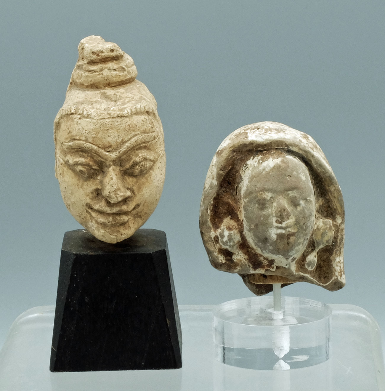 A pair of fine Han Dynasty tomb figure heads from China, ca. 206 BC ...